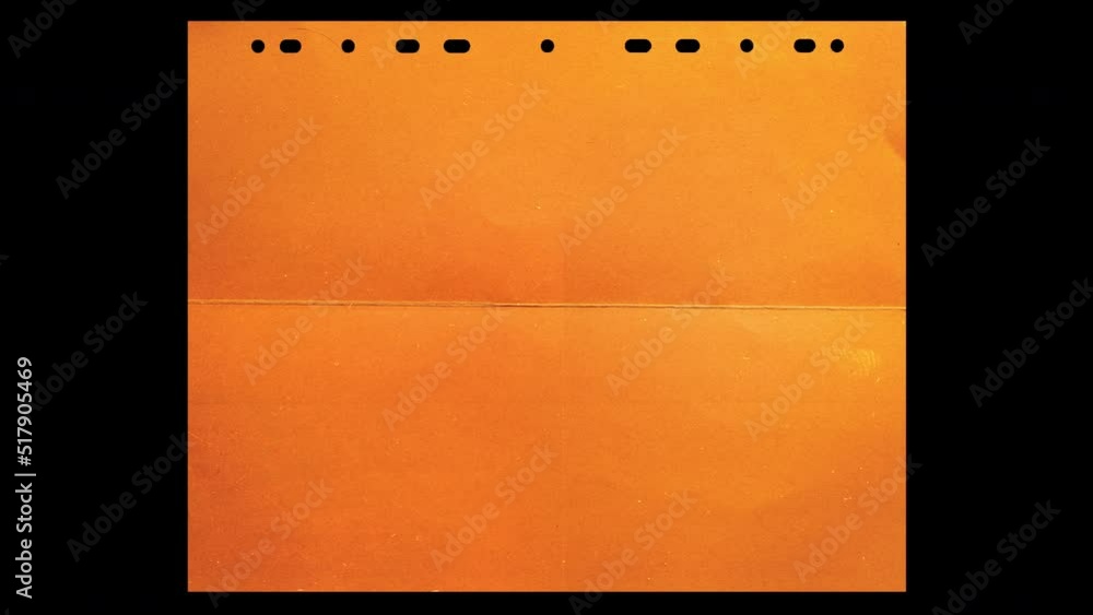 folded orange divider sheet paper isolated on black background. cool ...