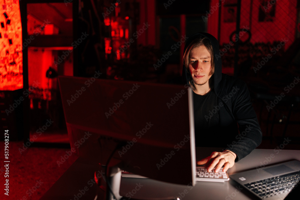 Portrait of wanted hacker man stealing information, preparing to break ...