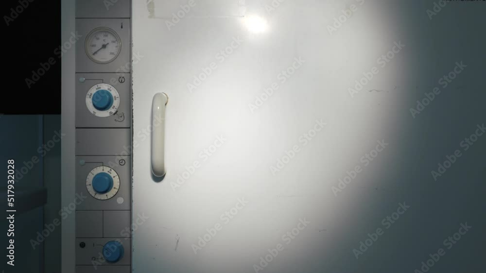Close-up of female healthcare worker hand turning door handle and ...