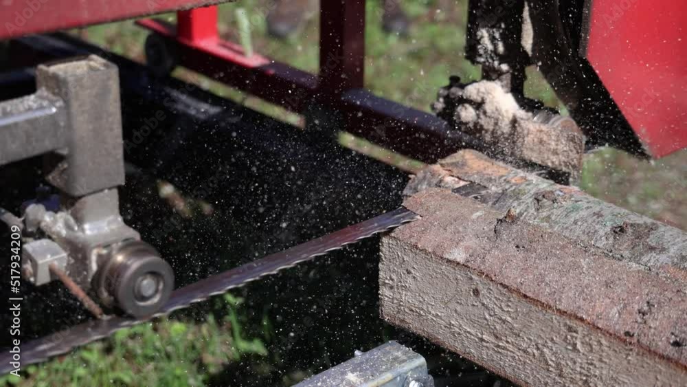 Short video shot close up to the moving blade of a heavy duty band ...