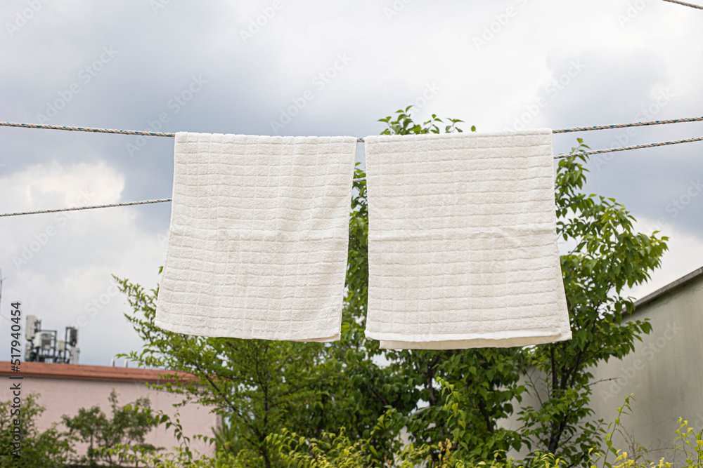 fresh clean white towels drying on washing line in outdoor Stock Photo ...