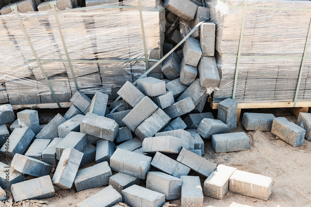 Storage of paving slabs on pallets at the construction site. Ready-to ...