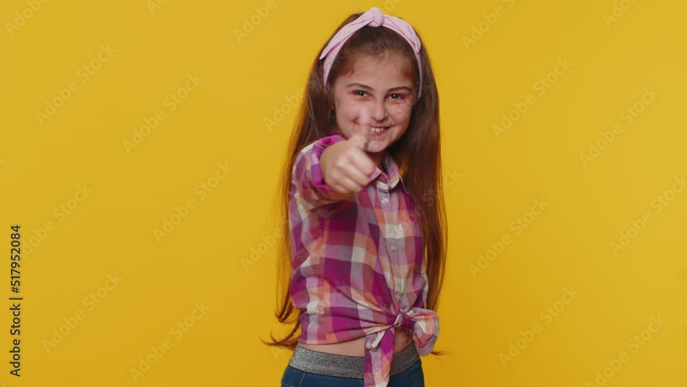 Like. Happy young preteen child girl kid looking approvingly at camera ...