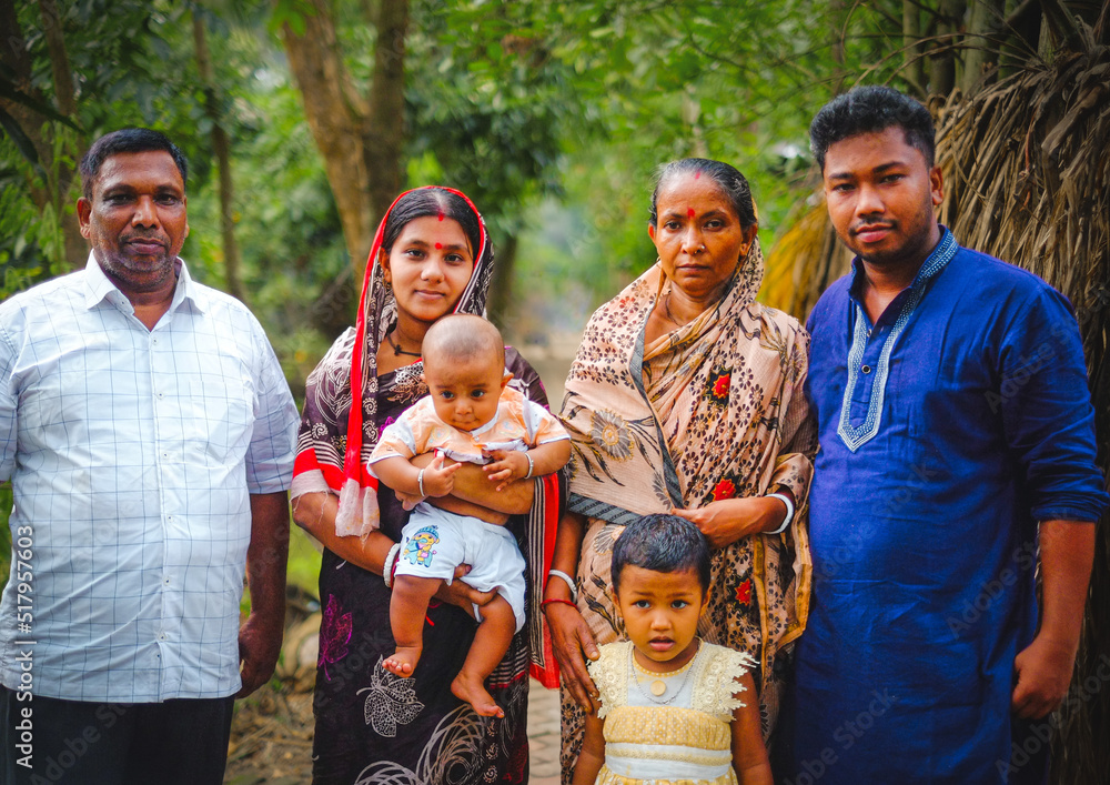South asian family picture . happy bangladeshi hindu family in a village outdoor environment ...