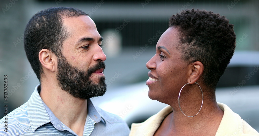 Mixed race couple kissing each other. Interracial husband and wife kiss ...