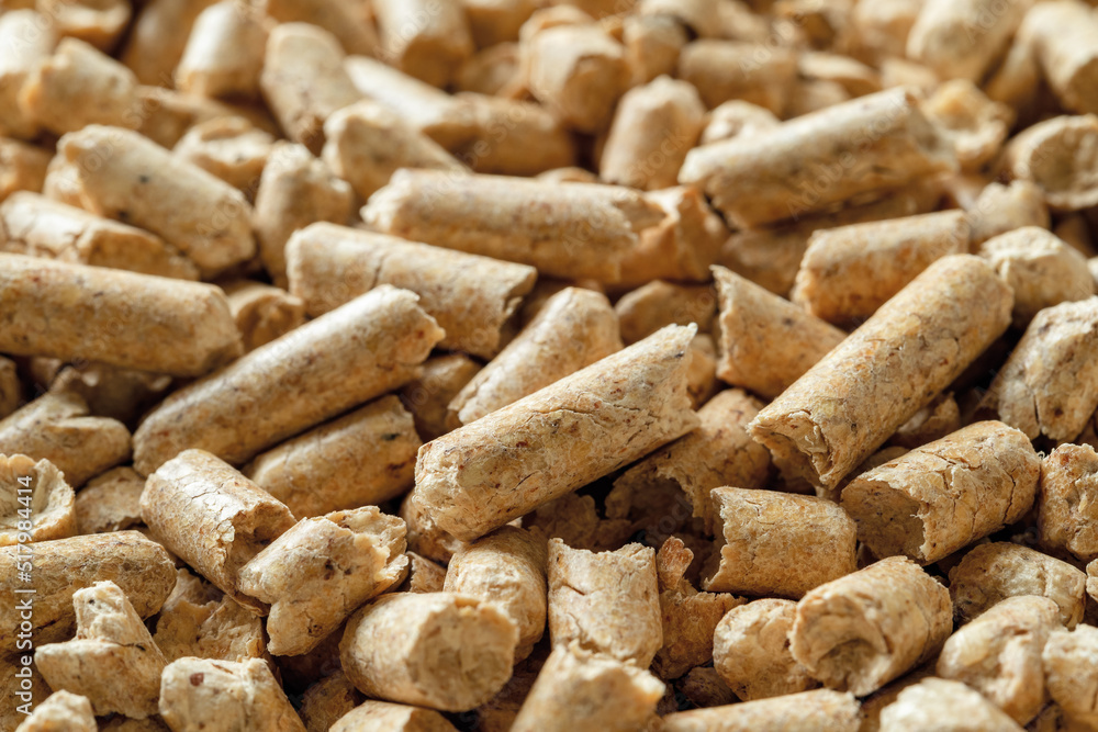 Wooden pellets macro background. Texture of compressed sawdust granules ...