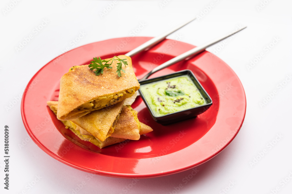 Cut Masala dosa or spring dosa is a South Indian meal served with ...
