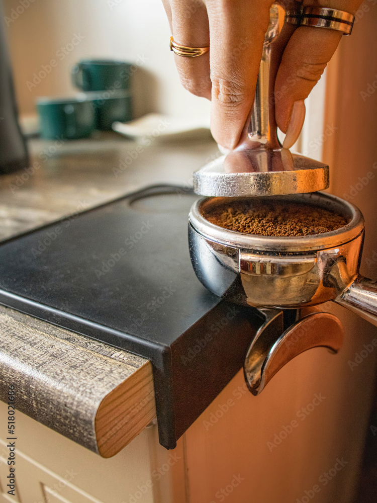 extraction of freshly ground, coffee from a professional coffee machine ...