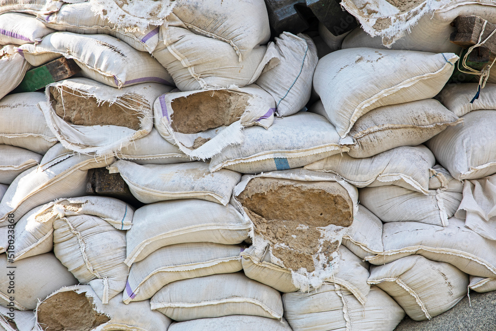 torn sandbags placed around historical monuments and roadblocks during ...