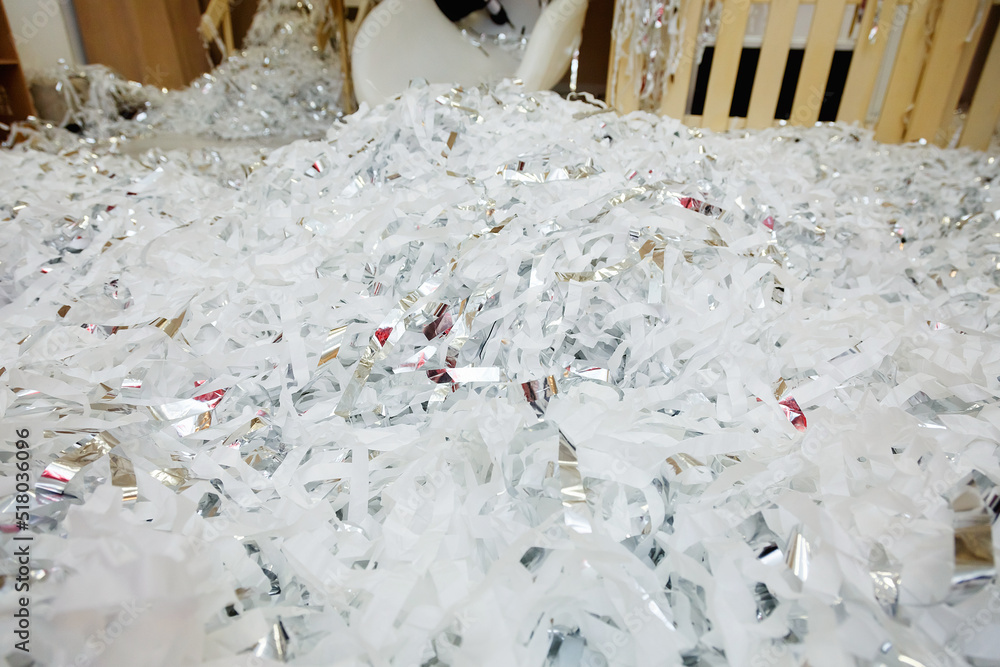 Textured background of shredded paper, top view of many strips of white ...