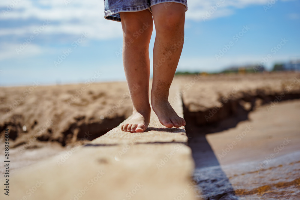 little girl crossing stream over handmade plank bridge Stock Photo ...