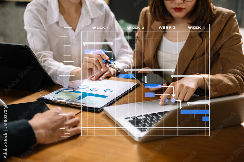 Project manager working and update tasks with milestones progress ...