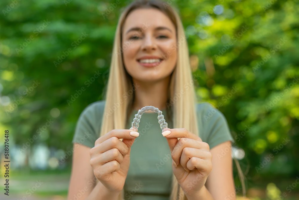 Women hand hold inivisalign braces, transparent aligner, invisible ...