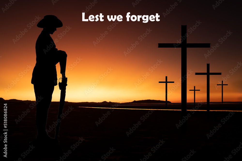 Silhouette of an Australian soldier with arms reversed against a golden ...