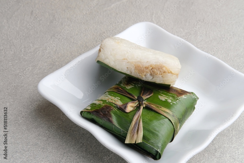 Lemper is an Indonesian savoury snack made of glutinous rice filled ...