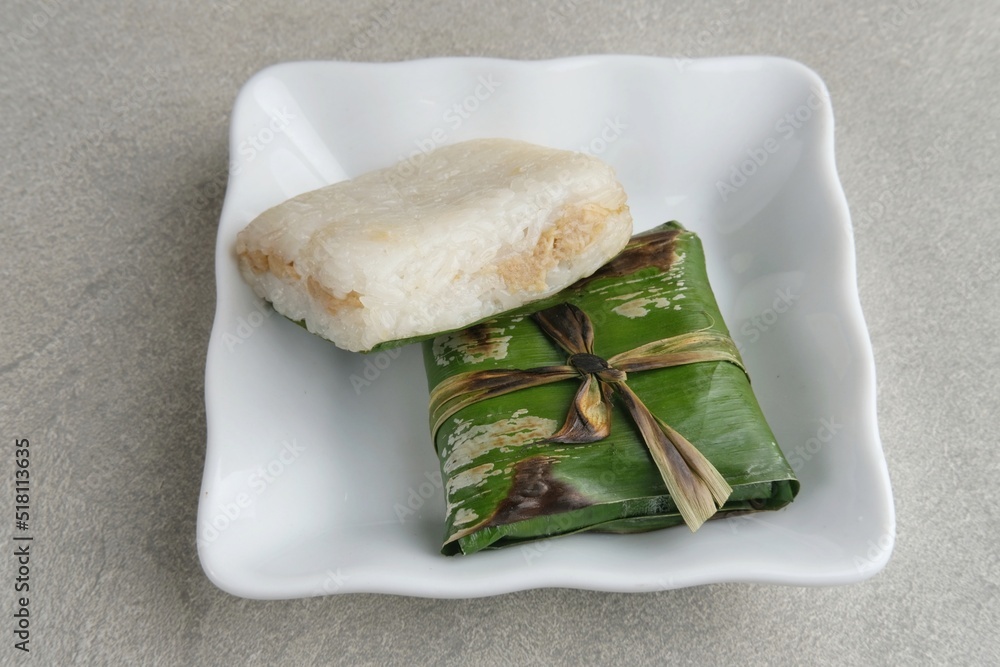 Lemper is an Indonesian savoury snack made of glutinous rice filled ...
