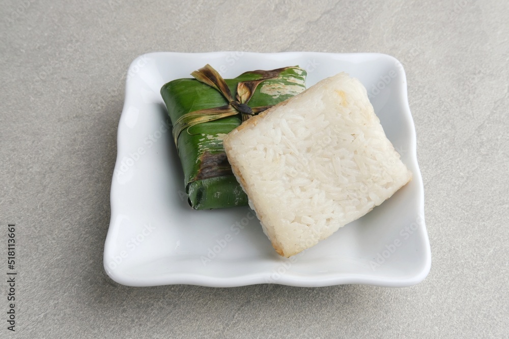 Lemper is an Indonesian savoury snack made of glutinous rice filled ...