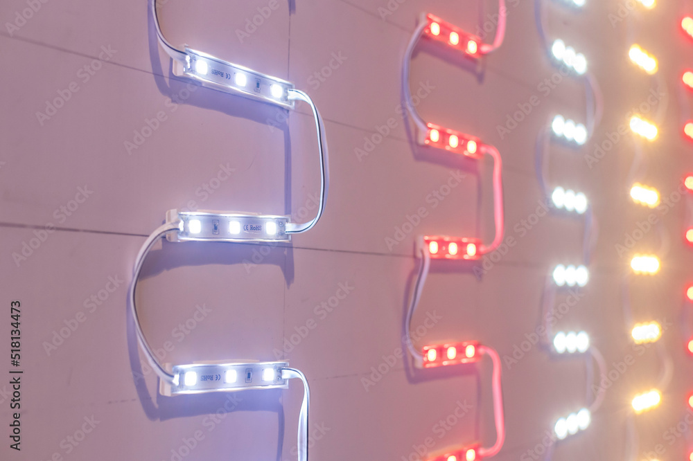 Strips of 12 volt poxy LED modules lights in various colors on display ...