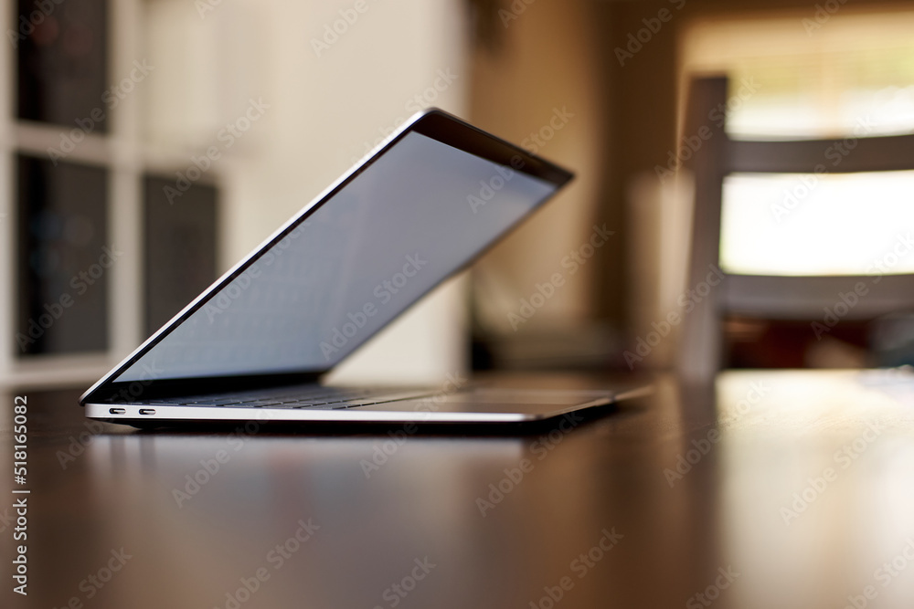 UK, Newcastle upon Tyne, 20 July 2022 - The half-opened MacBook Air ...