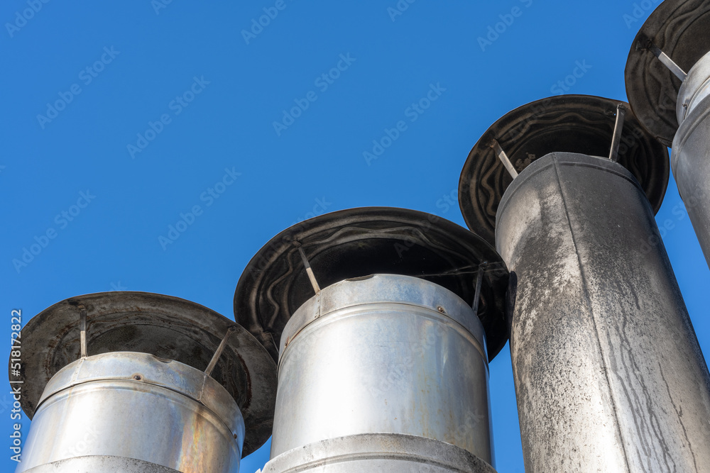 Side view of a Galvanized metal chimneys exhaust with a rain cap Stock ...