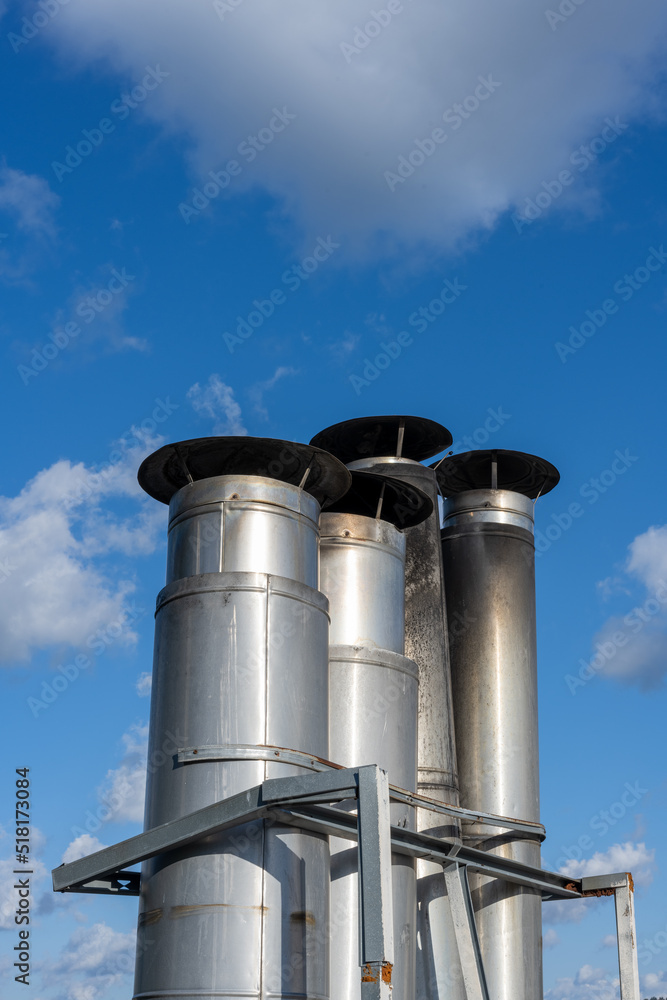 Side view of a Galvanized metal chimneys exhaust with a rain cap Stock ...