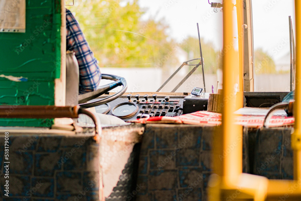 Bus driver panel inside a shabby old vintage passenger bus. Rudder ...