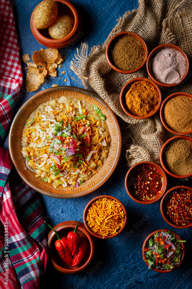 Traditional subcontinental street snack food chickpeas potato pani puri ...