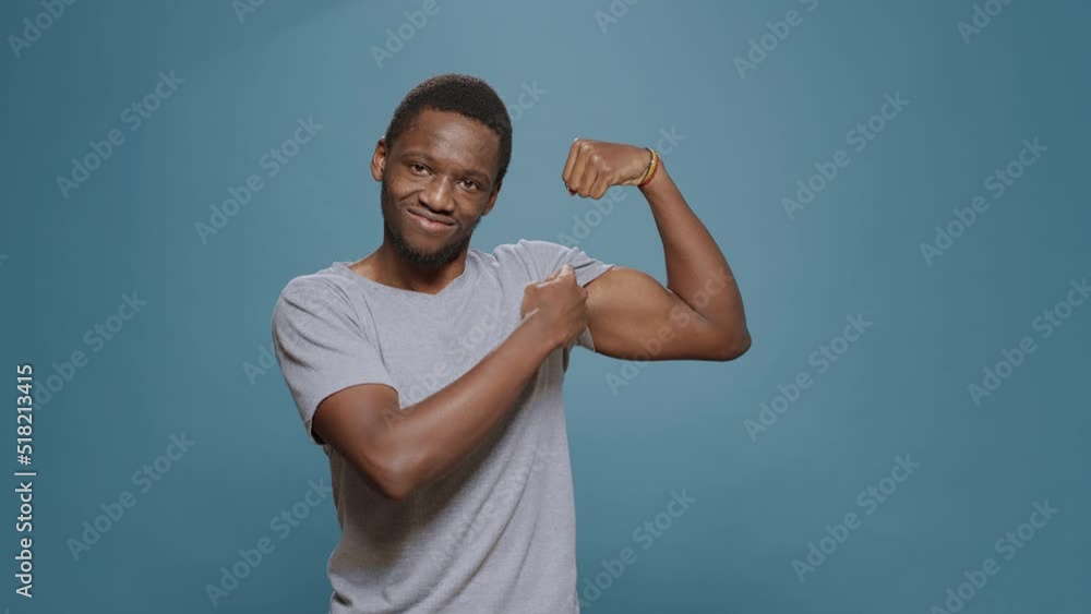Athletic person flexing biceps and triceps muscles on camera, showing ...