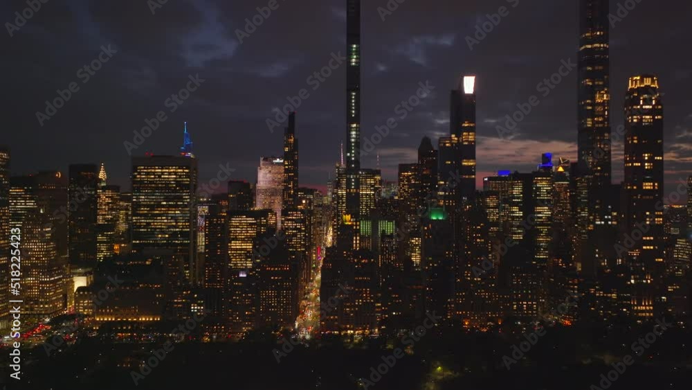 Night city scene. High rise buildings and downtown skyscrapers against ...