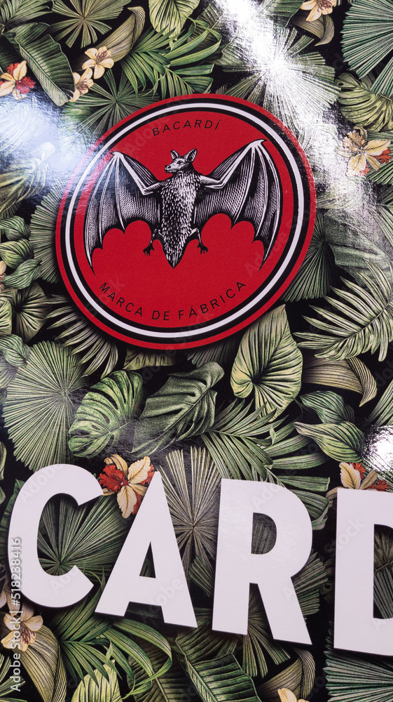 Bacardi rum brand logo and text sign on windows facade of bar pub Stock ...