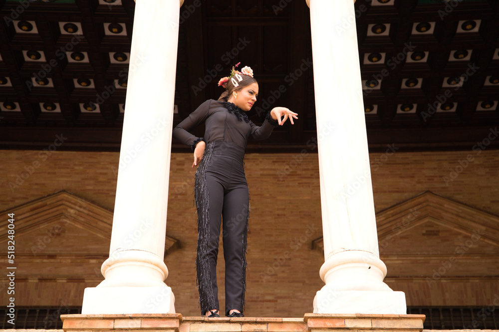 Beautiful teenage flamenco dancer with brown hair and dressed in dance ...