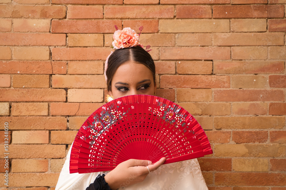 Beautiful teenage flamenco dancer with brunette hair and dressed in ...
