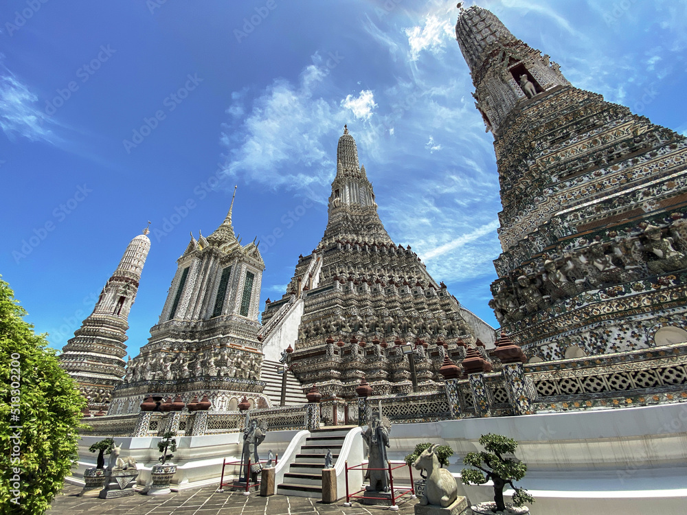 Wat Arun Temple in Bangkok, Thailand with stone pyramid towers, golden ...