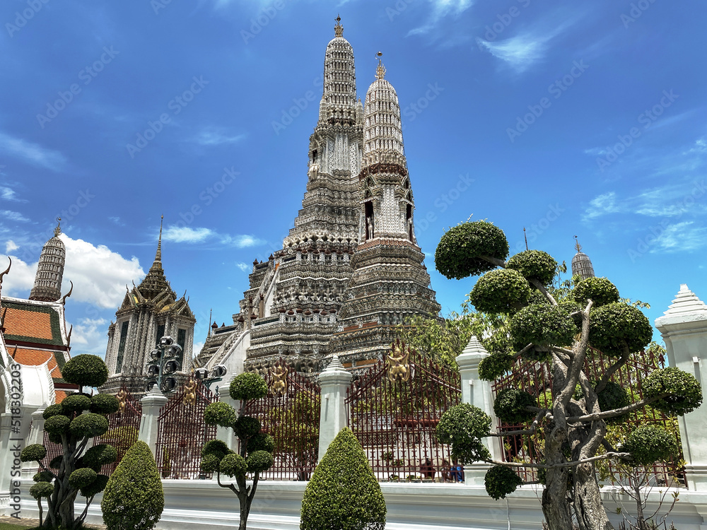 Wat Arun Temple in Bangkok, Thailand with stone pyramid towers, golden ...
