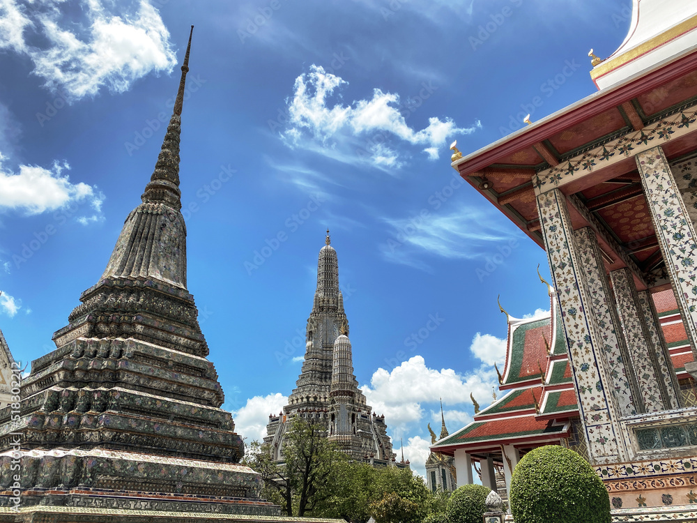 Wat Arun Temple in Bangkok, Thailand with stone pyramid towers, golden ...