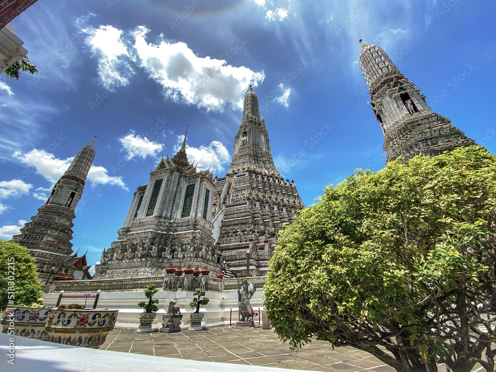Wat Arun Temple in Bangkok, Thailand with stone pyramid towers, golden ...