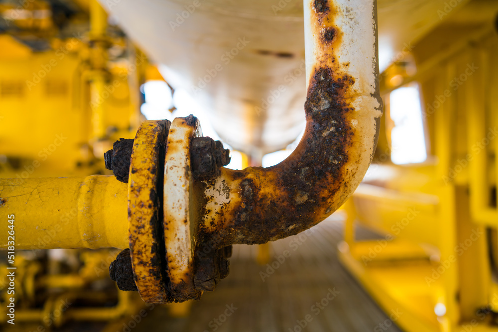 Steel pipe with blister paint, rust paint peeling off against the ...