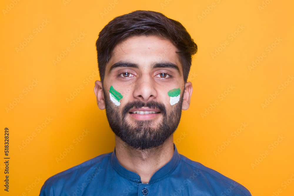 Young Boy with face paint green and white Pakistan Flag on face ...