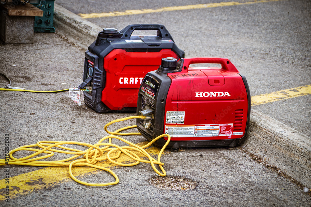Red and Black Honda and Craftsman portable generators sitting in ...