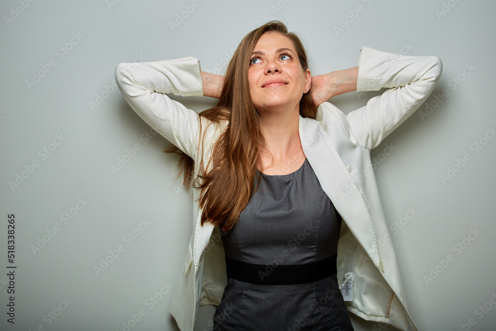 Resting and dreaming woman with hands behind neck looking up, isolated ...