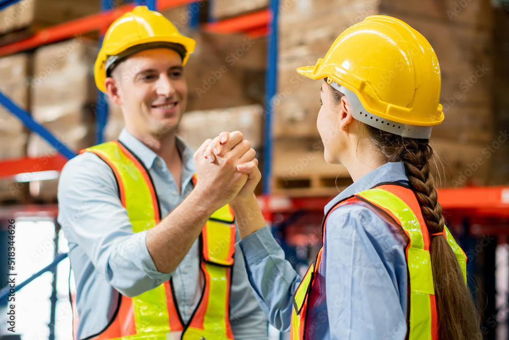 Warehouse workers soul brother handshake, thumb clasp handshake or ...