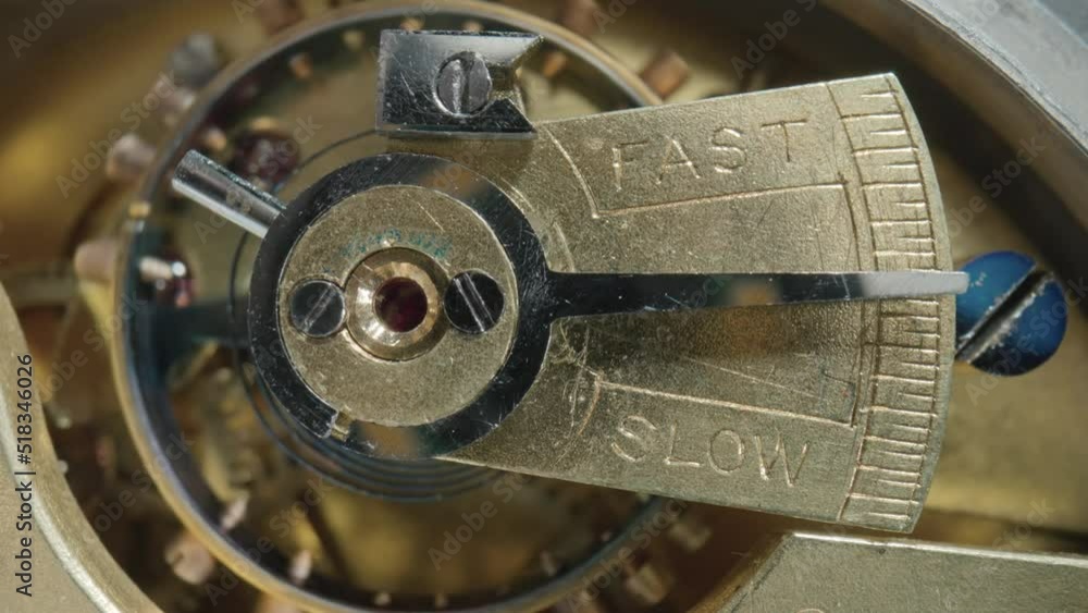 Internal vintage clockwork mechanism macro. Rotating gold gears, metal ...