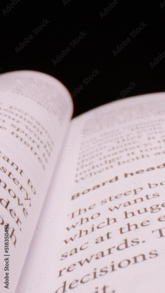 SUPER SLOW MOTION, CLOSE UP, PROBE LENS: Close up overview of open book ...
