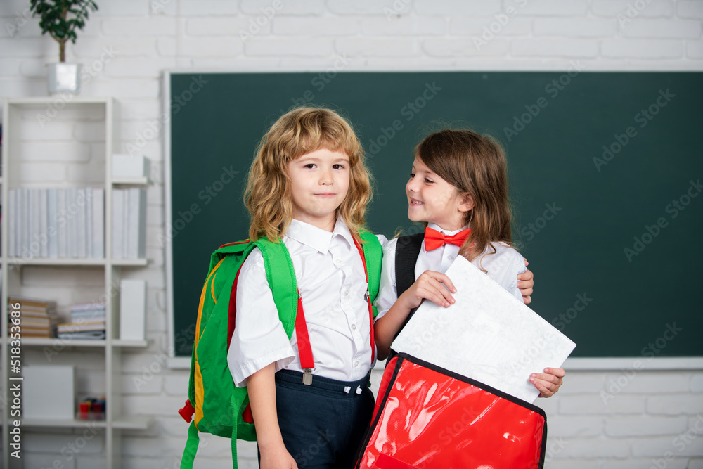 School friends learning together. Schoolgirl and schoolboy in classroom ...