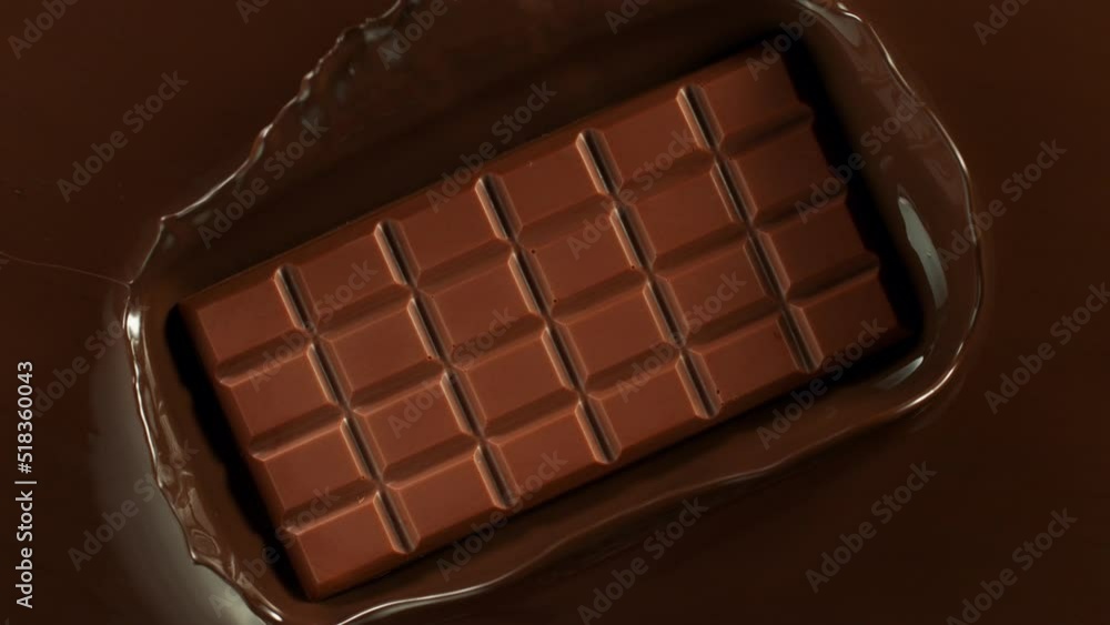 Super Slow Motion of Chocolate Bar Splashing Up From Melted Chocolate ...