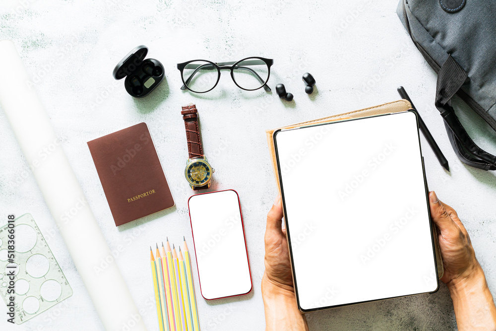 Working on a tablet screen on a white desk,Top view of businesspeople ...
