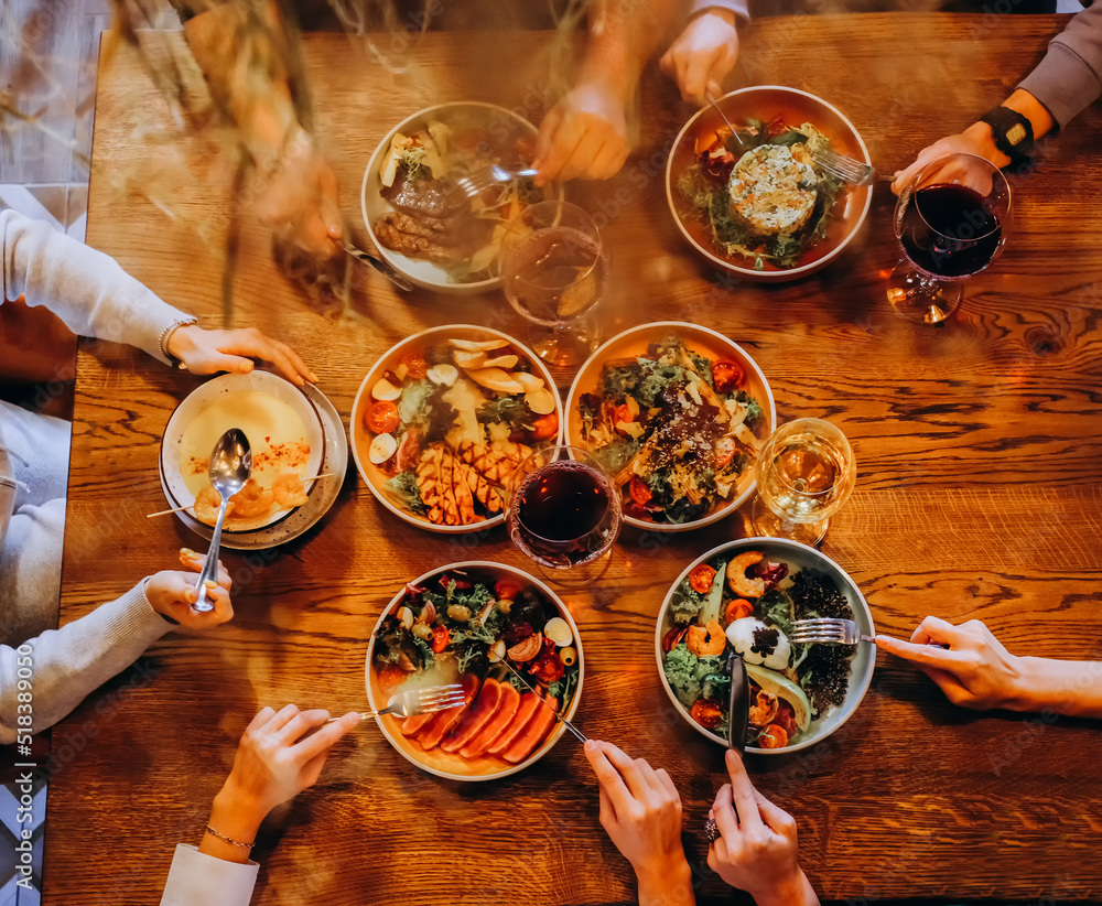 Eating and leisure concept -Top view group of people having dinner at ...