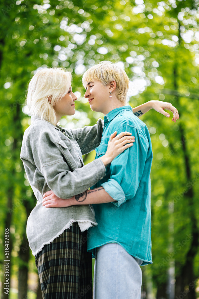 LGBT couple hugging and hanging out together on nature Stock Photo ...