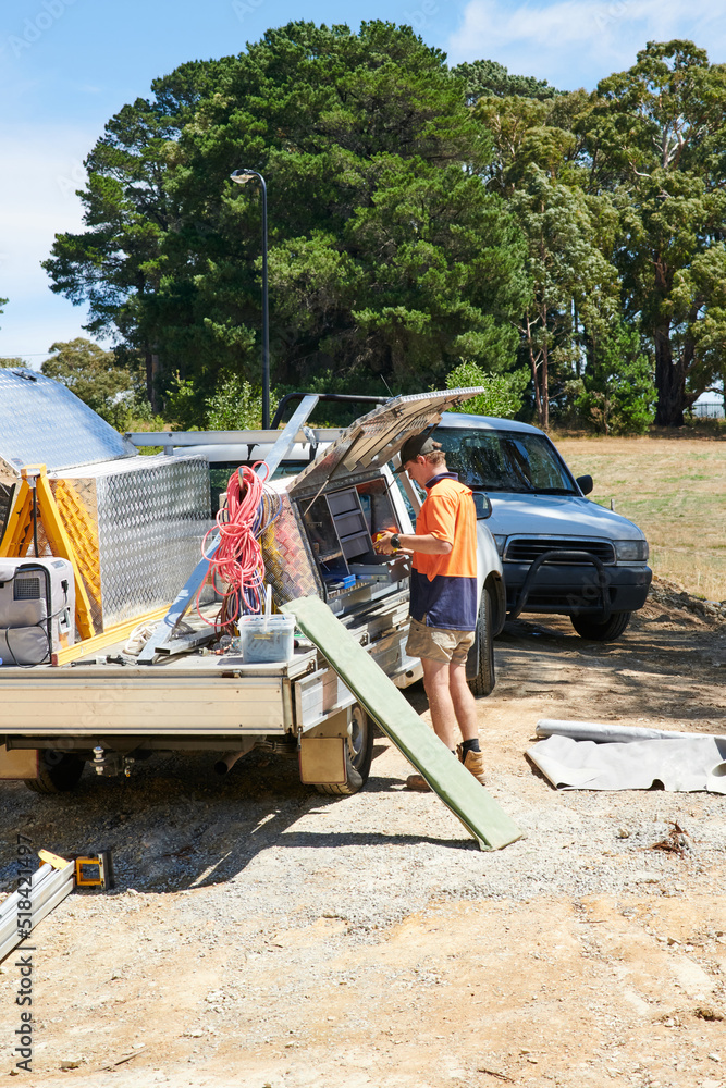 Apprentice tradie at his work truck Stock Photo | Adobe Stock
