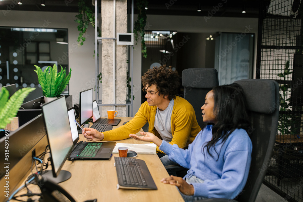 Co-workers Working On Their Project On Computer Stock Photo | Adobe Stock